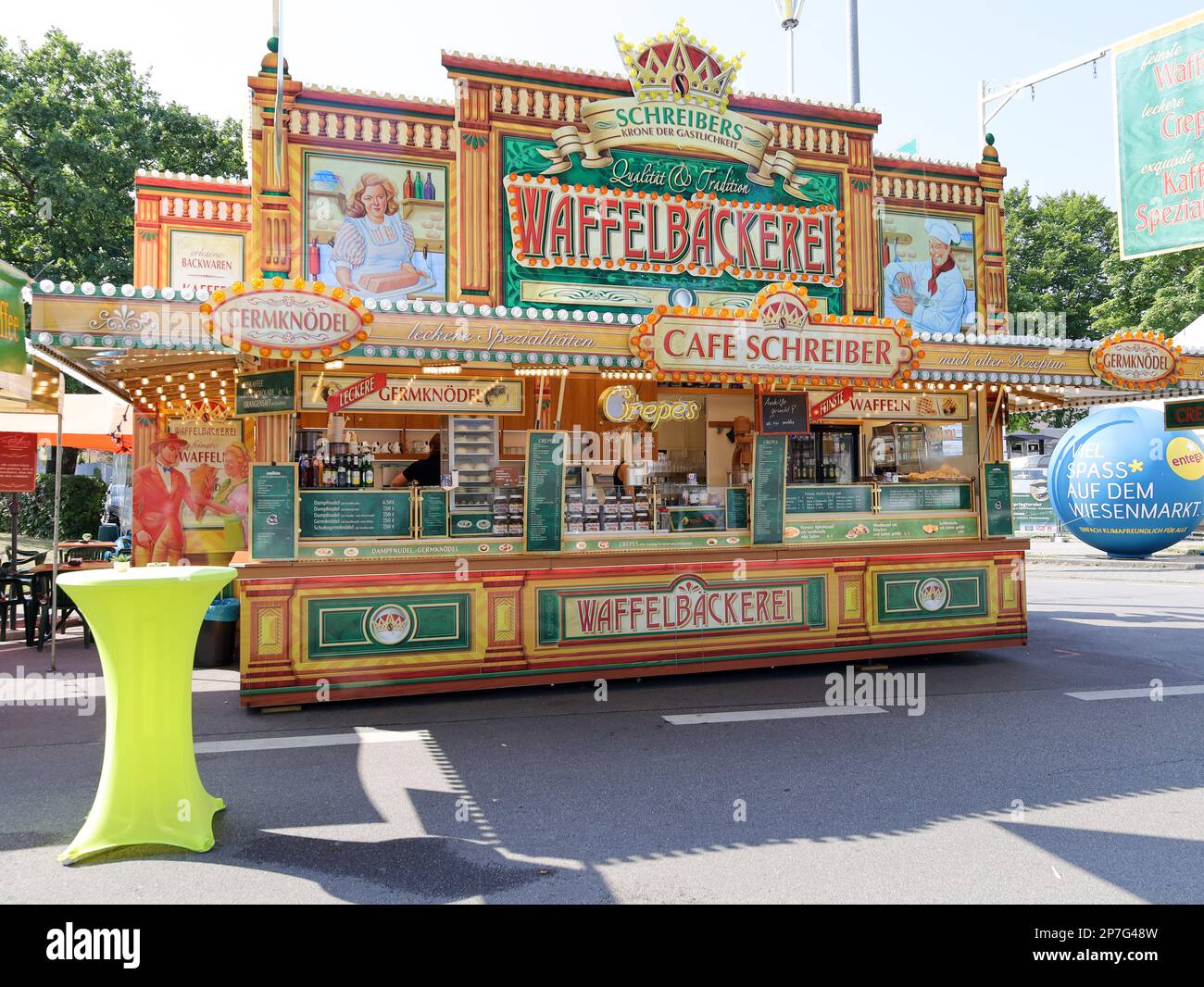 colorful booths and fun rides at a fairground Stock Photo - Alamy