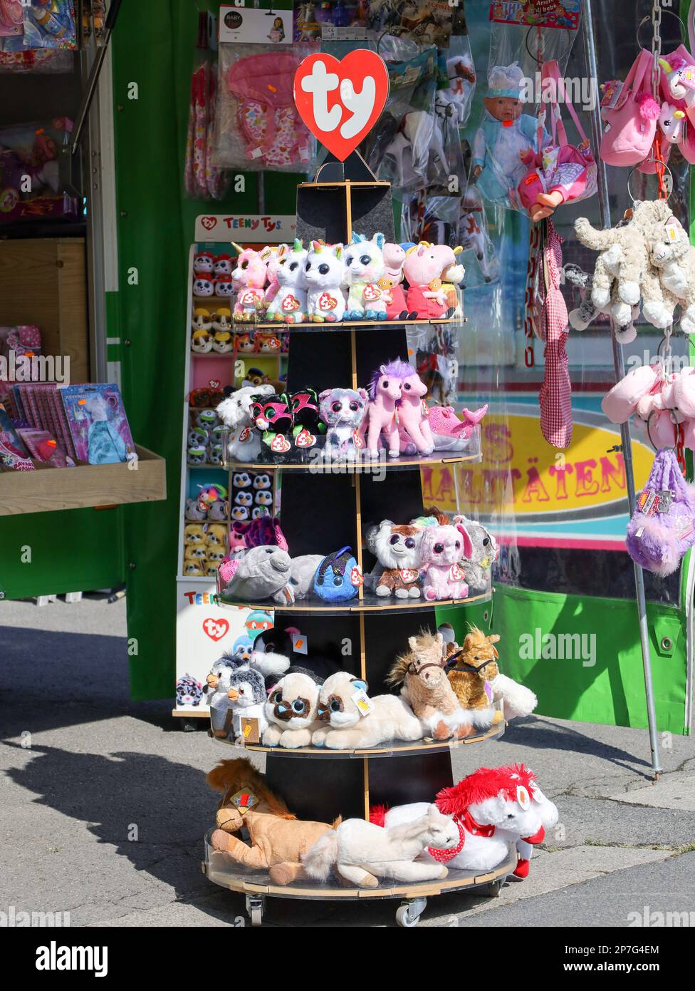 colorful booths and fun rides at a fairground Stock Photo - Alamy