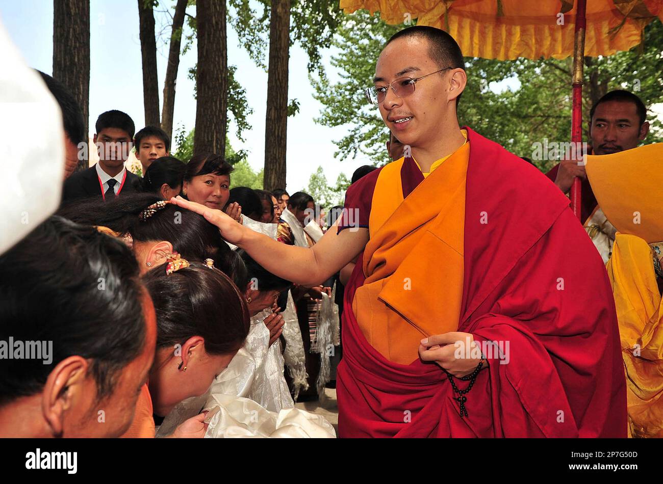11th Panchen Lama Gyaincain Norbu (R) arrives for a Buddhist ceremony ...