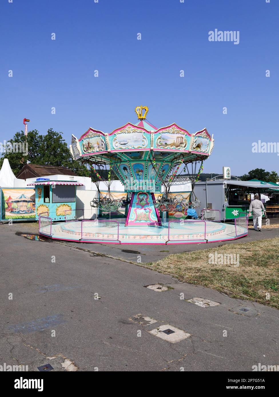 colorful booths and fun rides at a fairground Stock Photo - Alamy