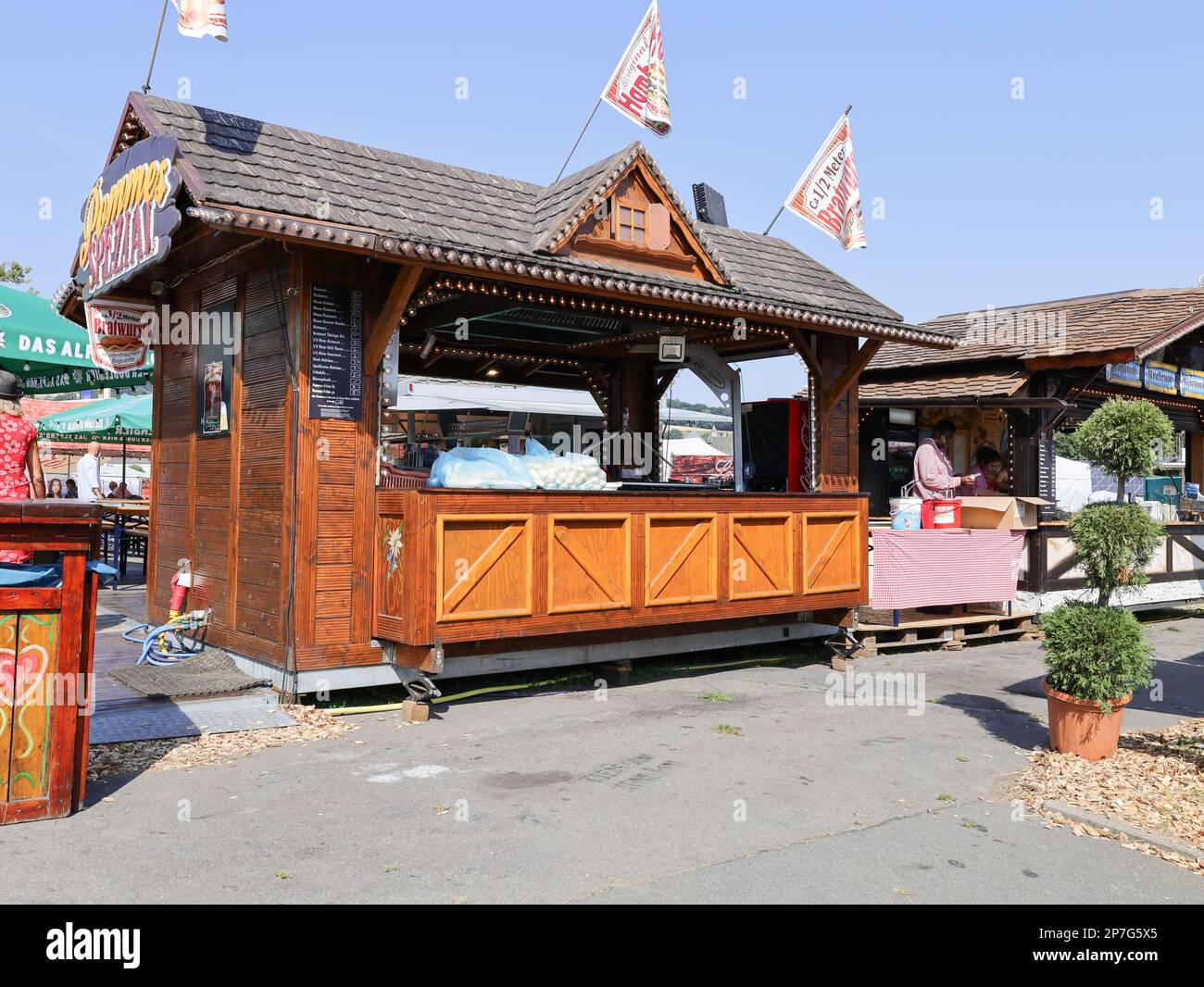 colorful booths and fun rides at a fairground Stock Photo - Alamy