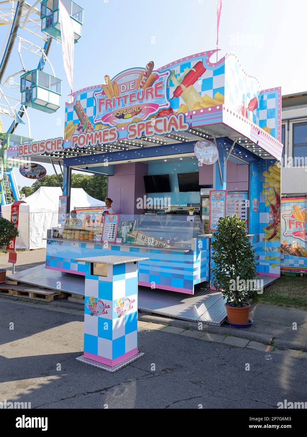 colorful booths and fun rides at a fairground Stock Photo - Alamy