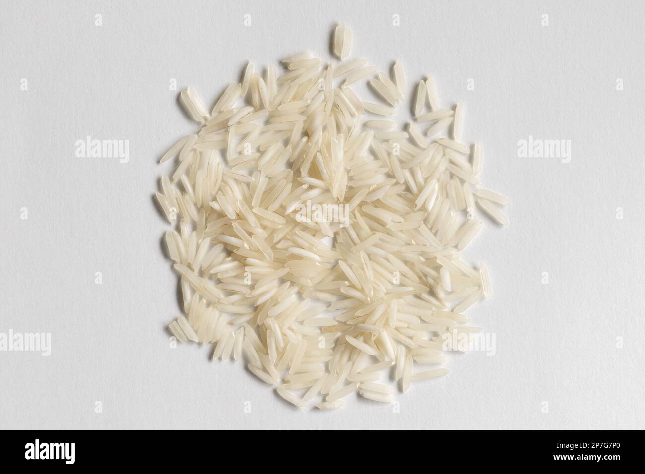 Basmati long rice on a white background Stock Photo - Alamy