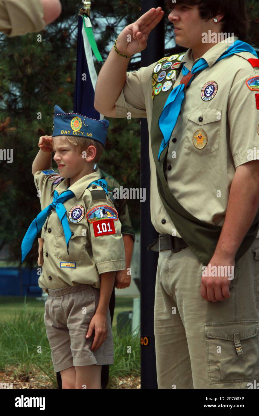 Spencer Halk, 5, left, and Mike Courier, 15, of Essexville Boy Scouts of America troop 101 ...