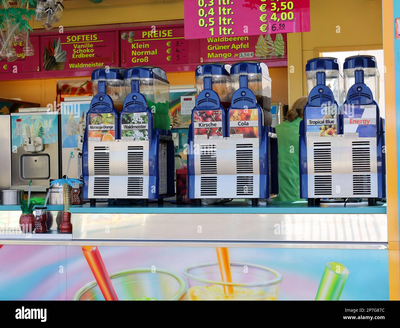 colorful booths and fun rides at a fairground Stock Photo - Alamy