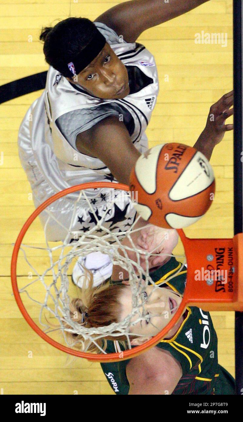 San Antonio Silver Stars' Michelle Snow, top, watches her shot as she ...