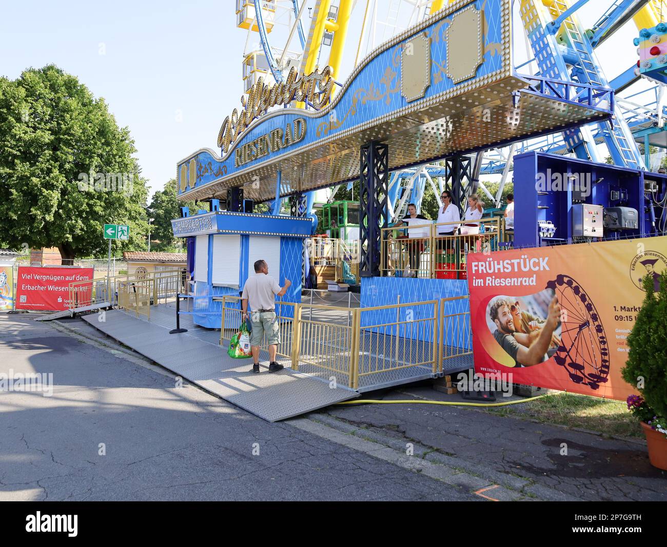 colorful booths and fun rides at a fairground Stock Photo - Alamy