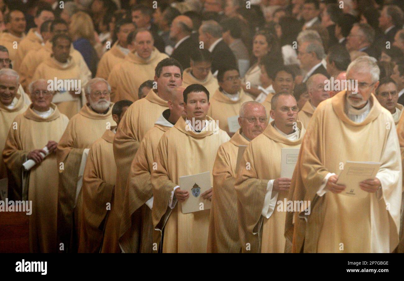 Roman Catholic priests arrive for a welcoming Mass at the Cathedral of ...