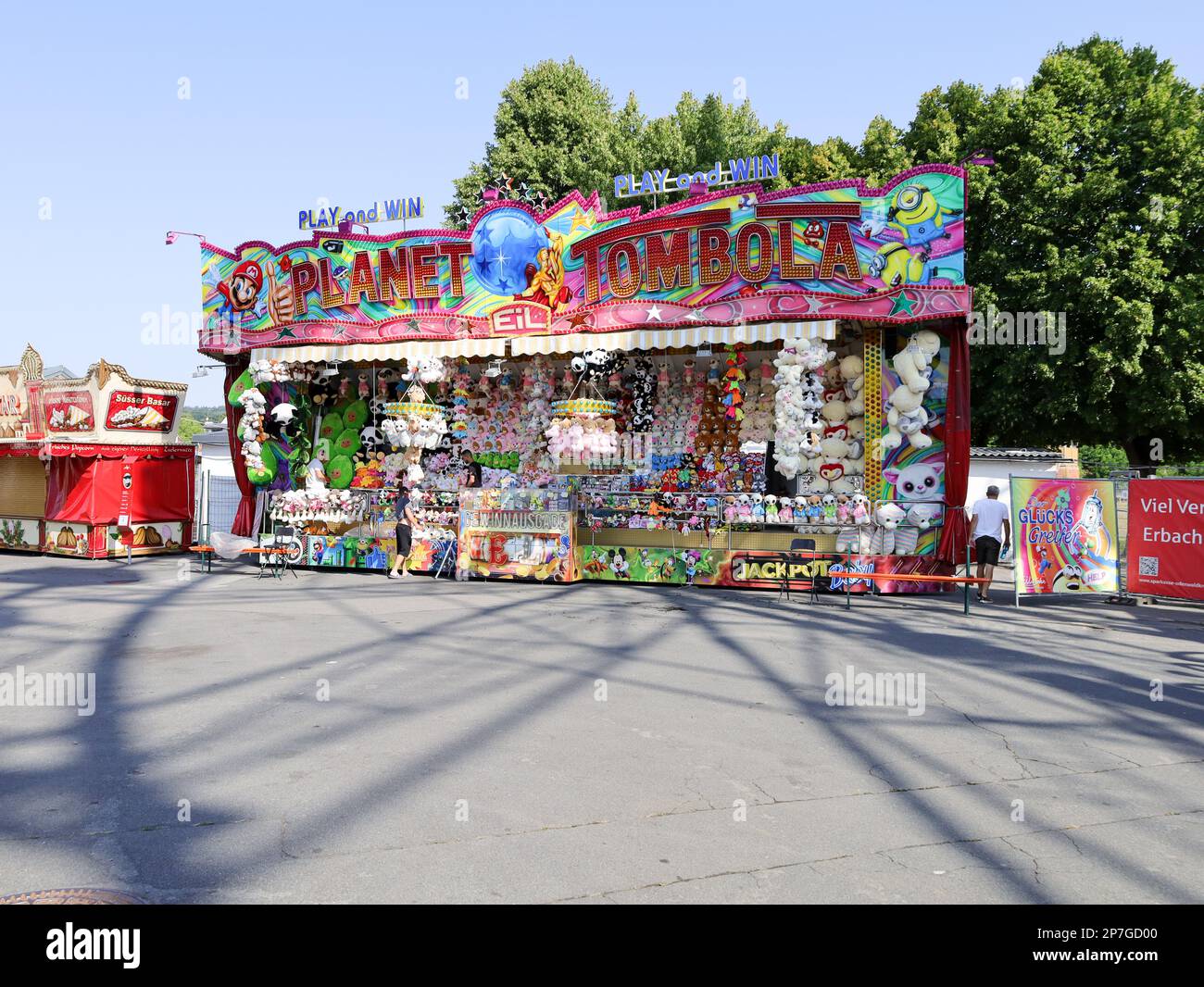 colorful booths and fun rides at a fairground Stock Photo - Alamy