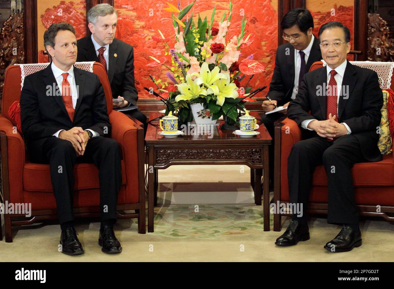 China's Premier Wen Jiabao, right, talks with U.S. Treasury Secretary ...