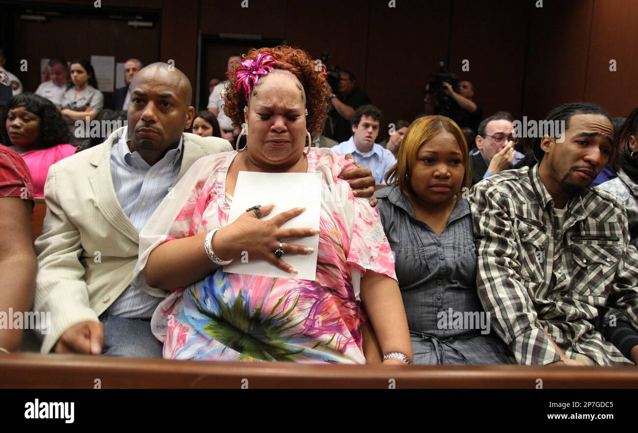 Shalga Hightower, center, mother of victim Iofemi Hightower, reacts and ...