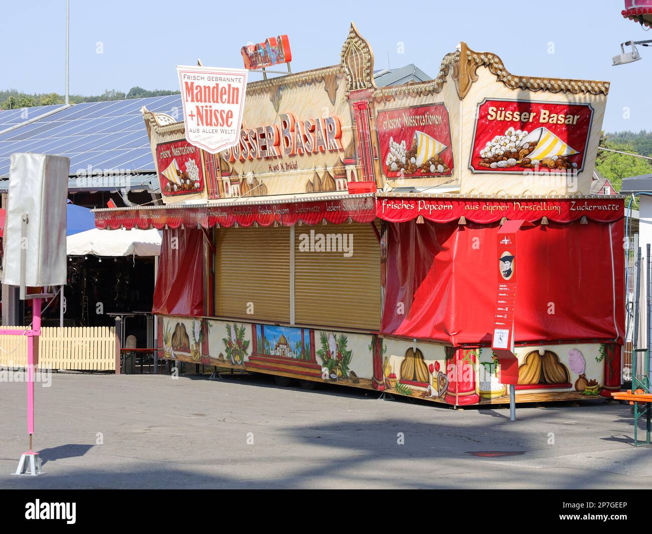 colorful booths and fun rides at a fairground Stock Photo - Alamy