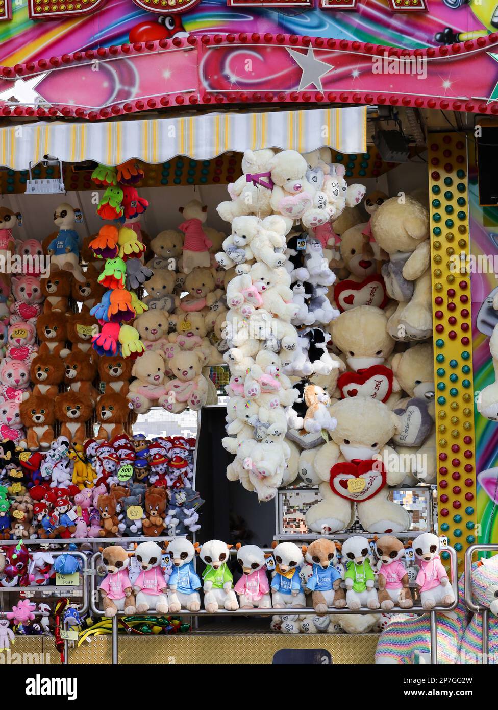 colorful booths and fun rides at a fairground Stock Photo - Alamy