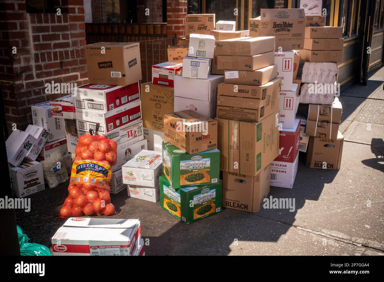 A delivery of foodstuffs and other restaurant supplies in front of a ...