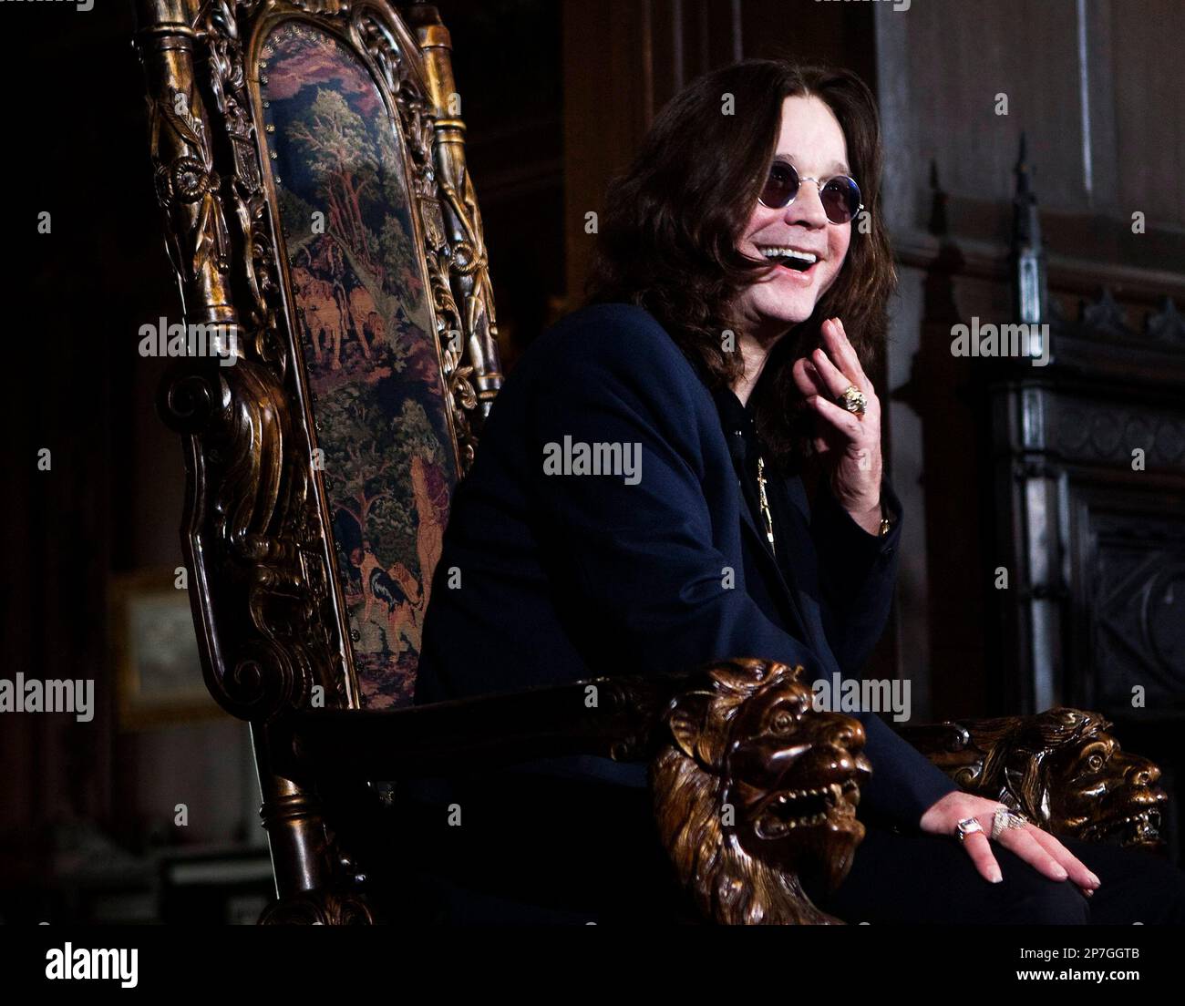 Music legend Ozzy Osbourne laughs during a news conference for his new ...