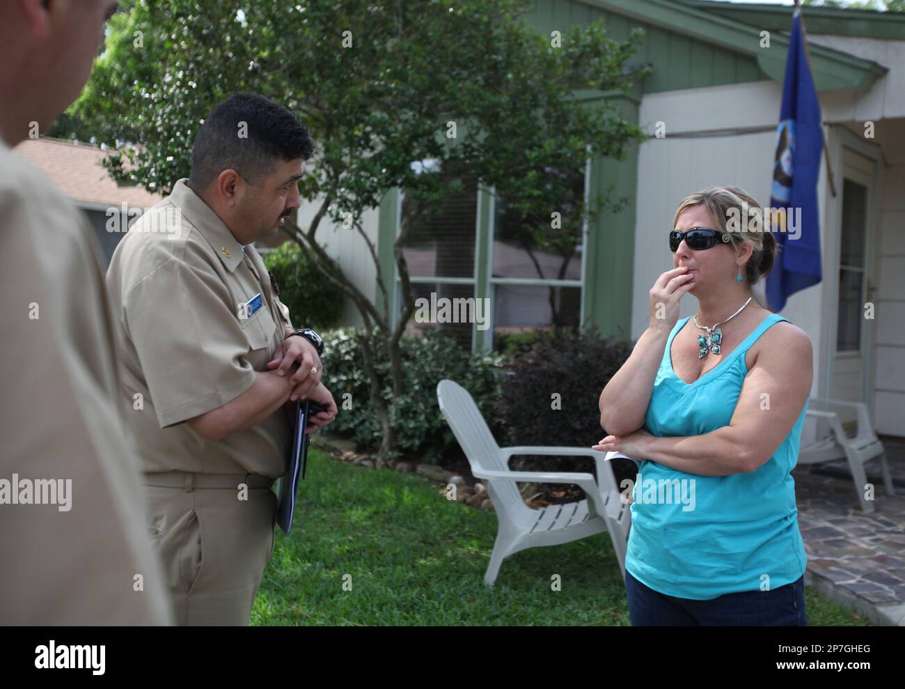 Krista Hamilton, sister of Zarian Wood, talks with Navy personnel about ...