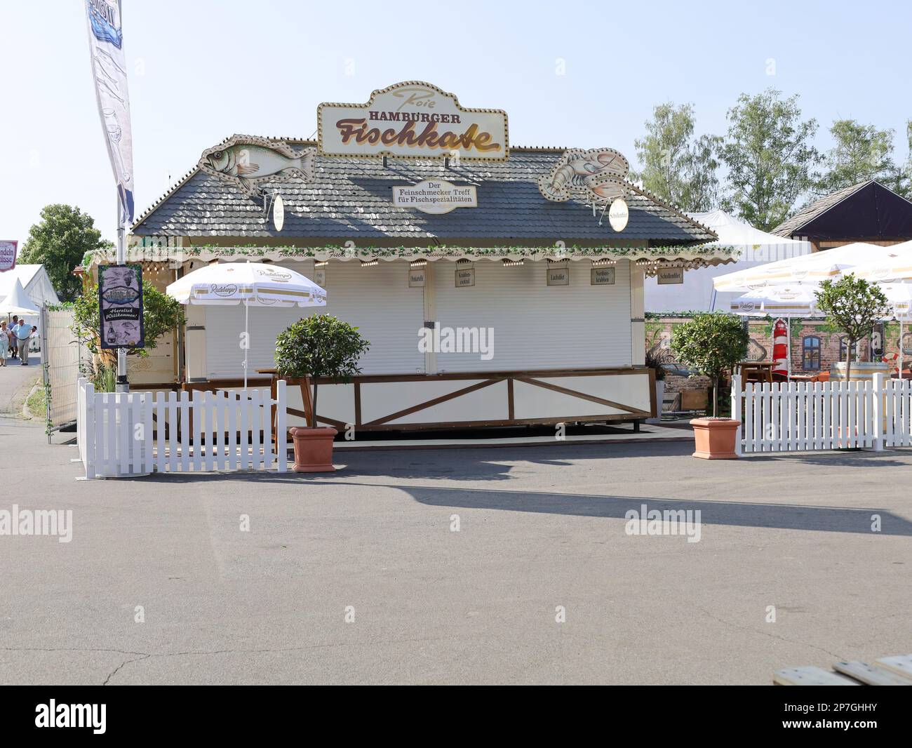 colorful booths and fun rides at a fairground Stock Photo - Alamy