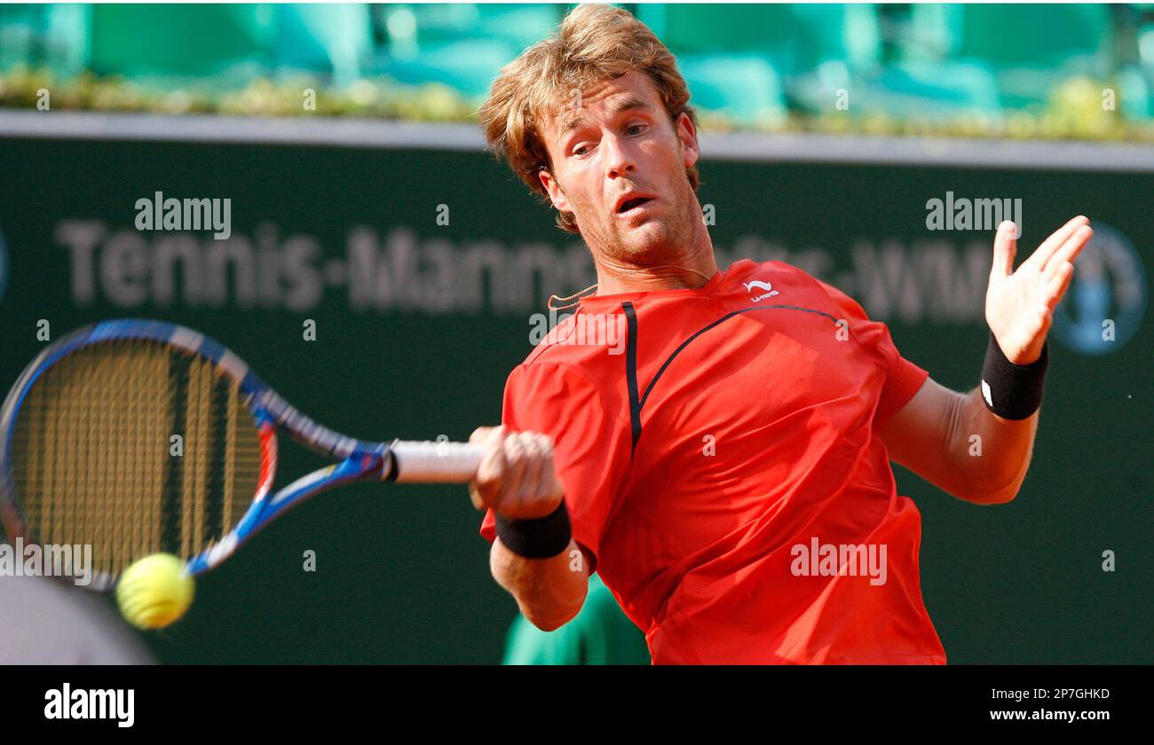 Daniel Gimeno-Traver from Spain returns the ball to Sam Querrey from ...