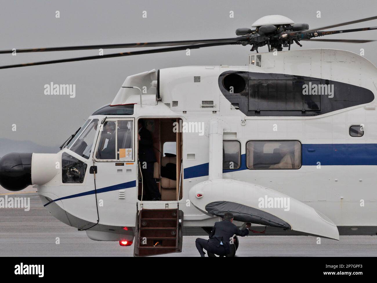 Pope Benedict XVI, seen through a window of the helicopter arrives at ...