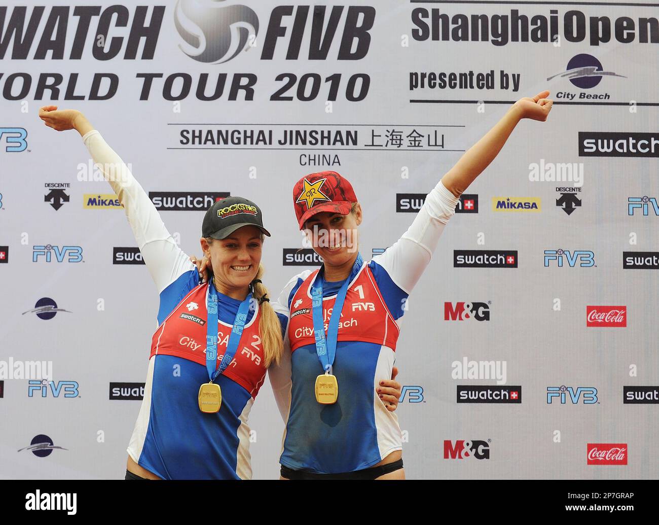 U.S.' Jennifer Kessy (L) and April Ross celebrate after winning the ...