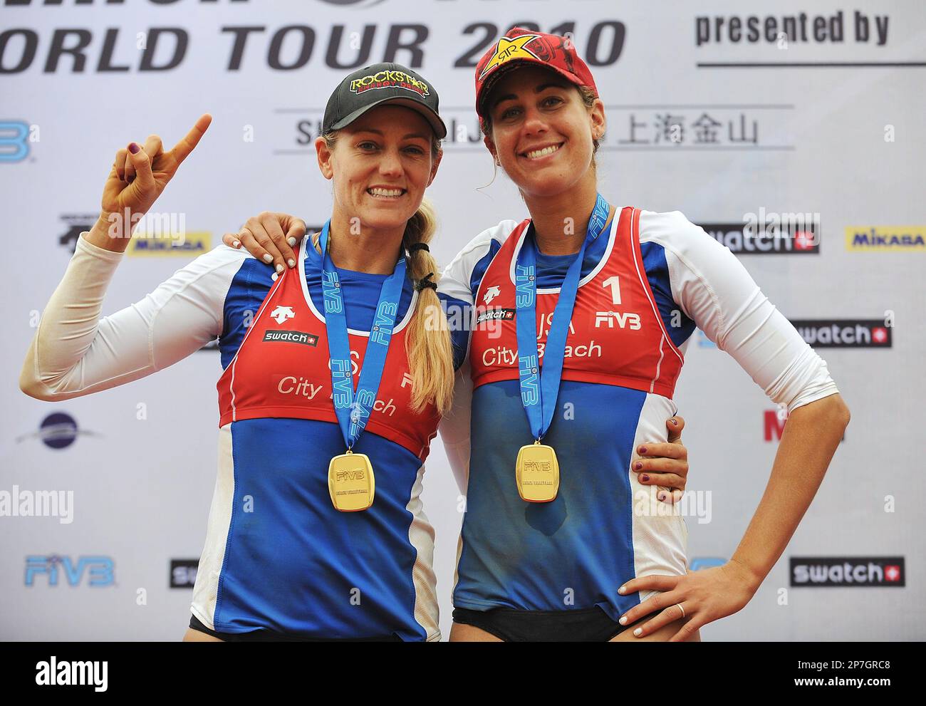U.S.' Jennifer Kessy (L) and April Ross celebrate after winning the ...