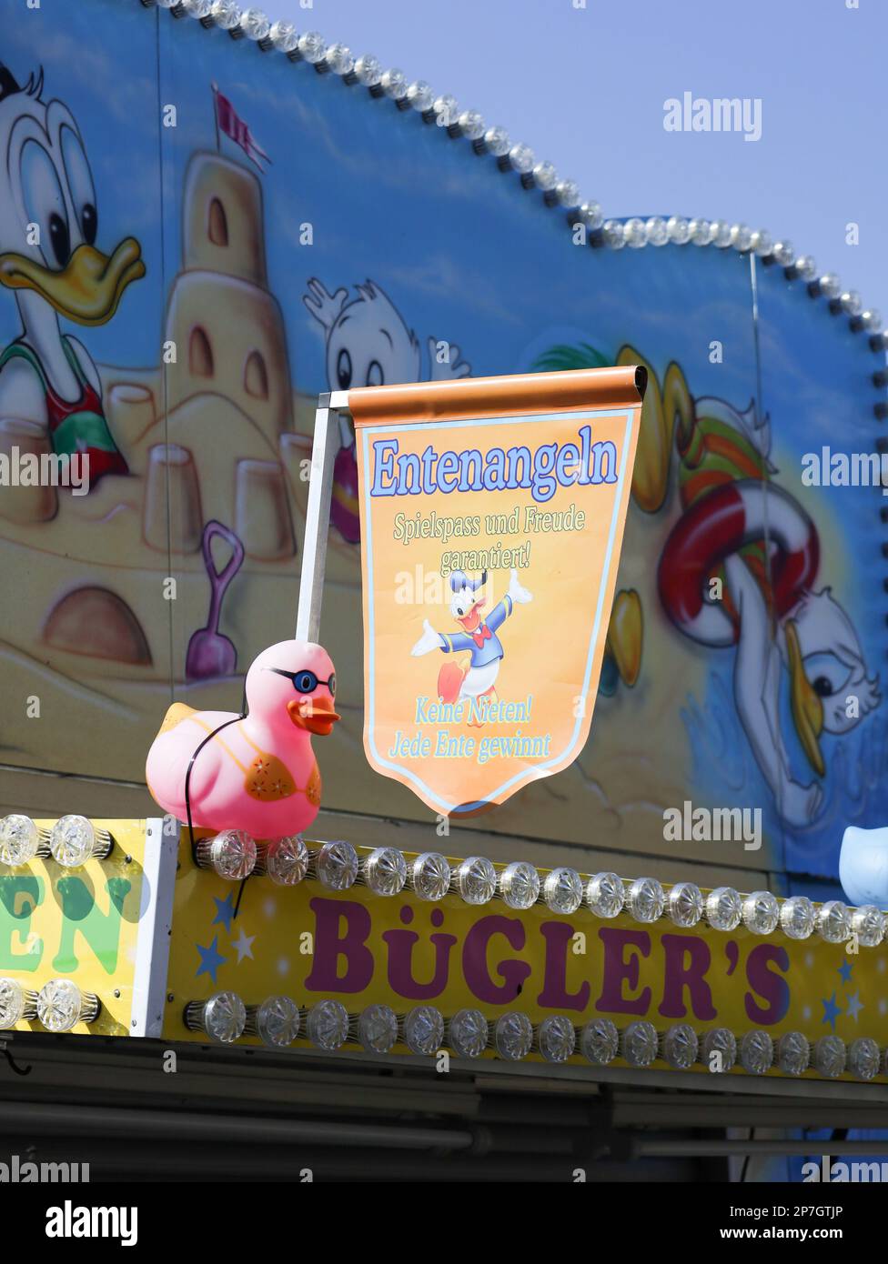 colorful booths and fun rides at a fairground Stock Photo - Alamy