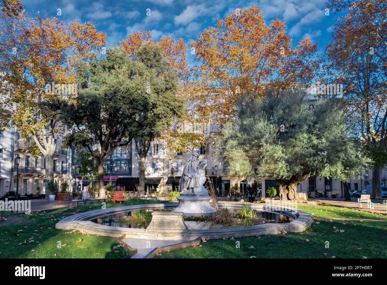 Nimes city in France, a pretty wooded square in the historic centre ...