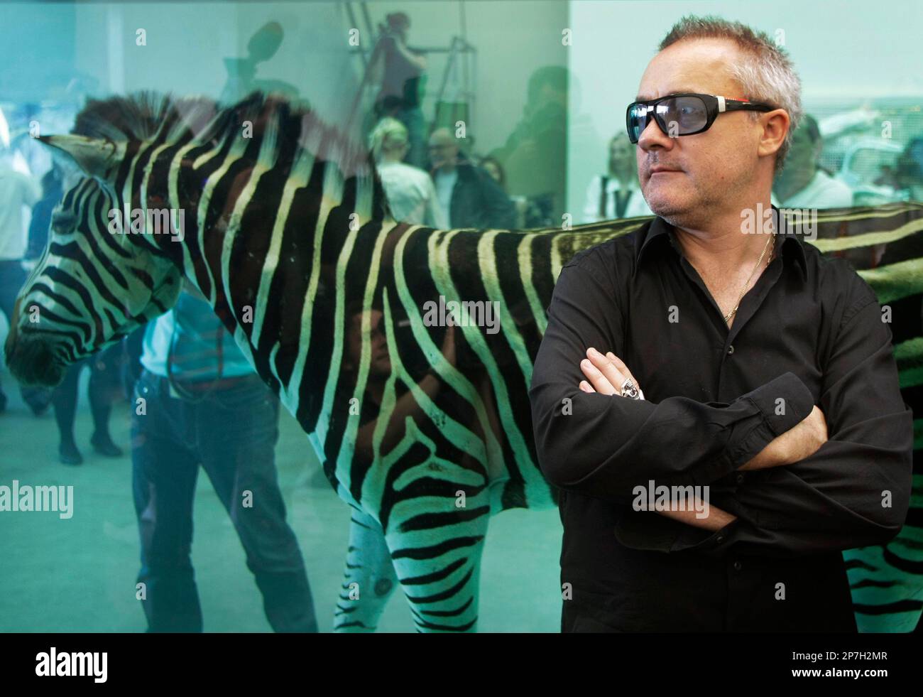 British artist Damien Hirst poses in front of his work 'The Incredible ...
