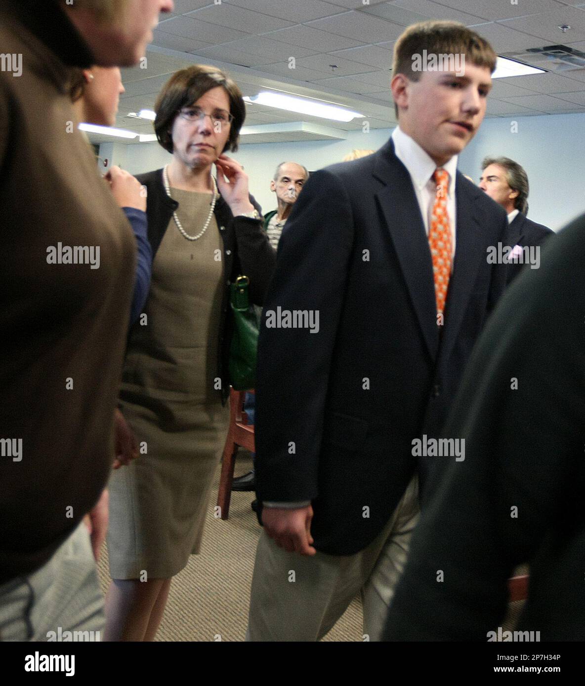 Carman Alenson, left, leaves the courtroom with her family after the ...