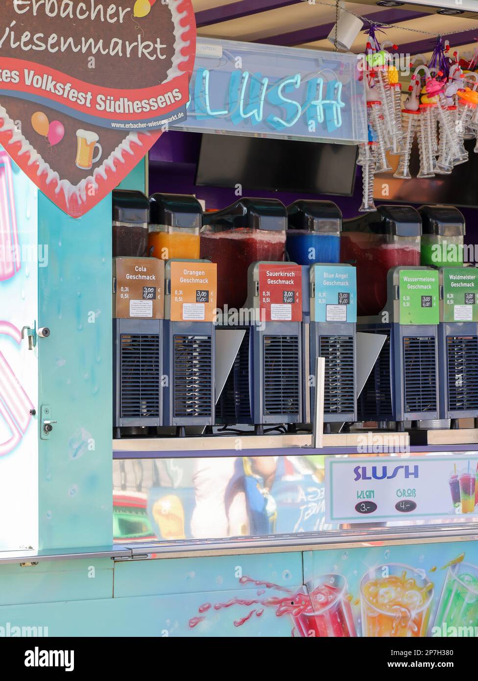 colorful booths and fun rides at a fairground Stock Photo - Alamy