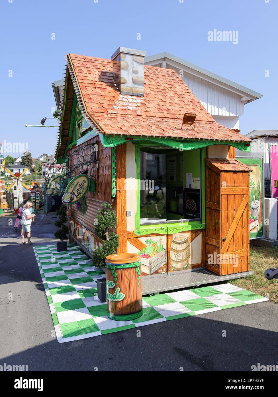 colorful booths and fun rides at a fairground Stock Photo - Alamy
