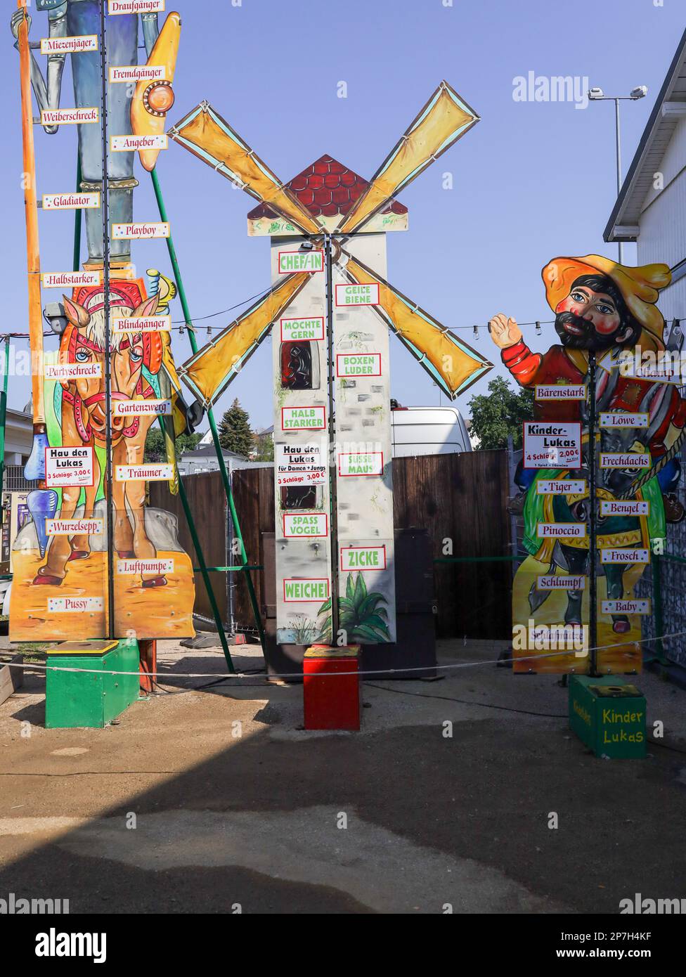 colorful booths and fun rides at a fairground Stock Photo - Alamy