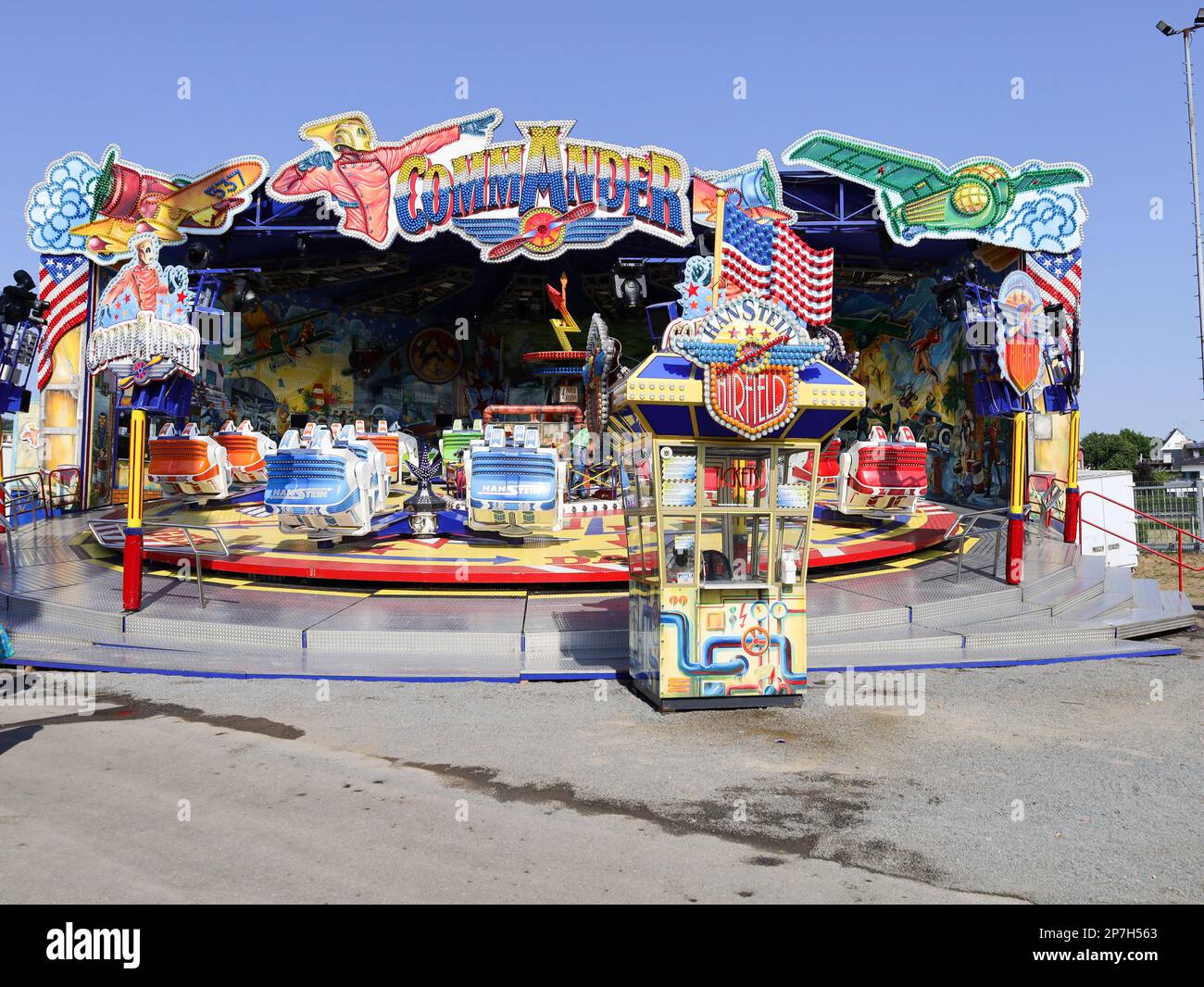 colorful booths and fun rides at a fairground Stock Photo - Alamy
