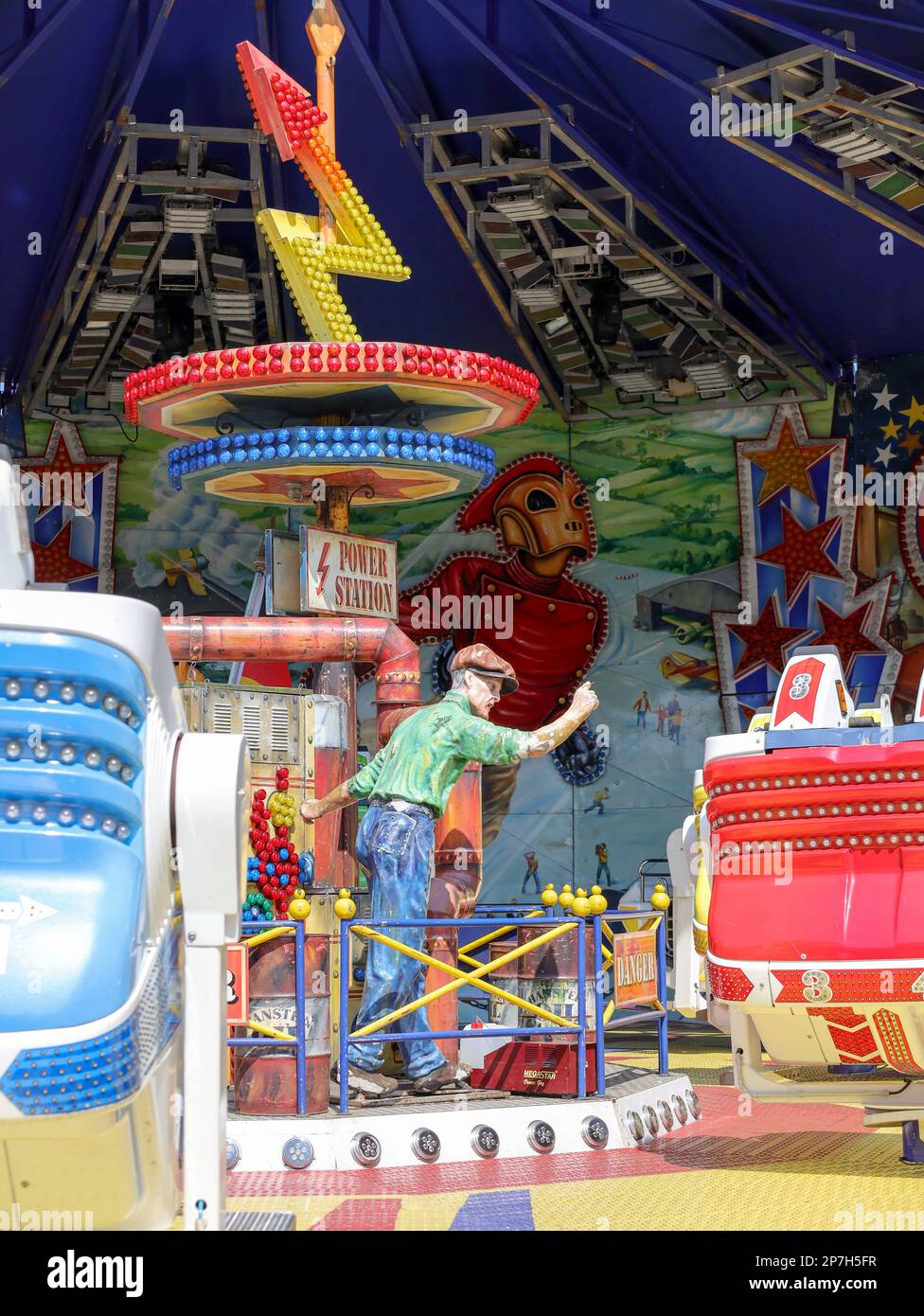 colorful booths and fun rides at a fairground Stock Photo - Alamy