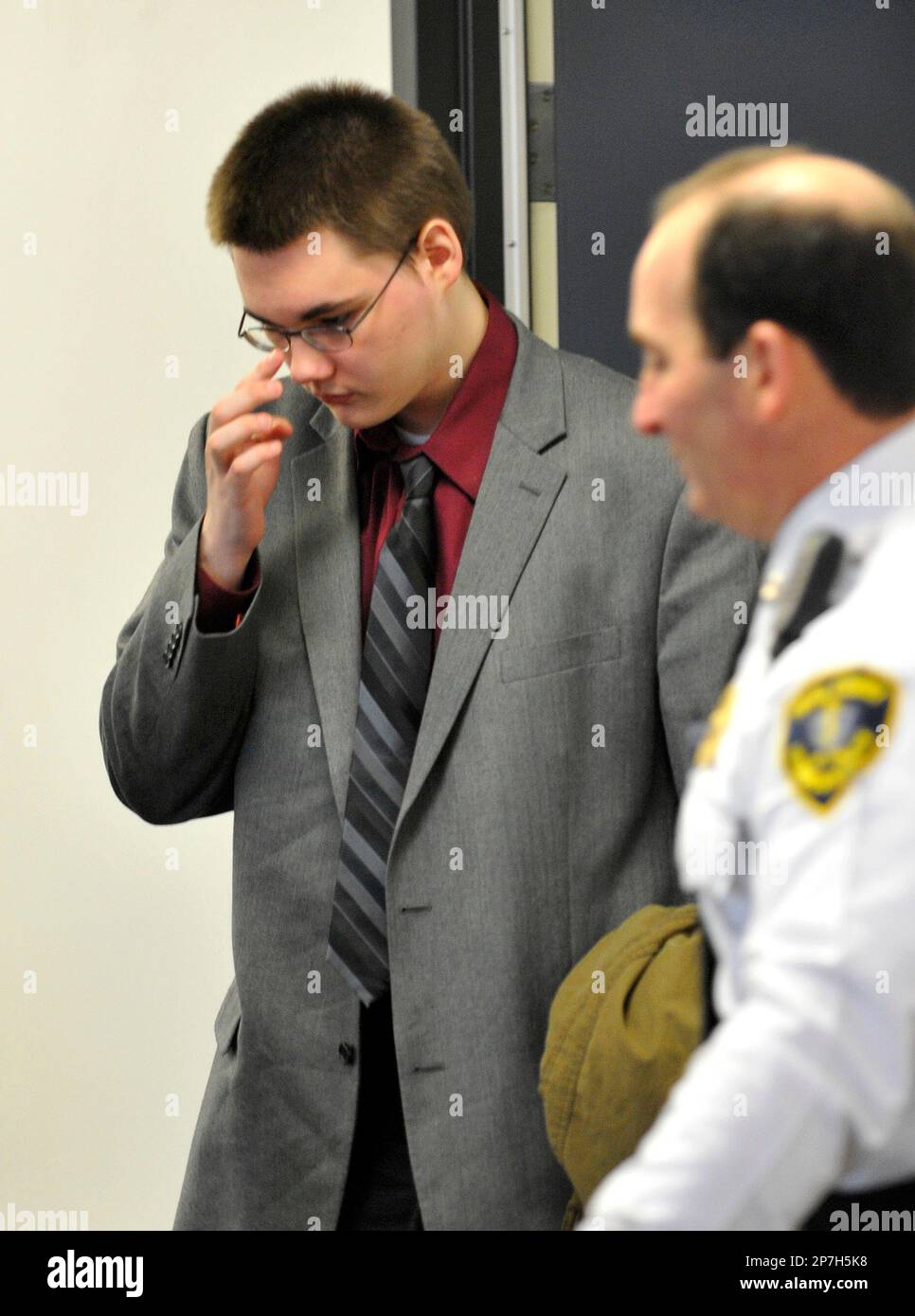 John Odgren, left, steps into a courtroom at Middlesex Superior Court ...