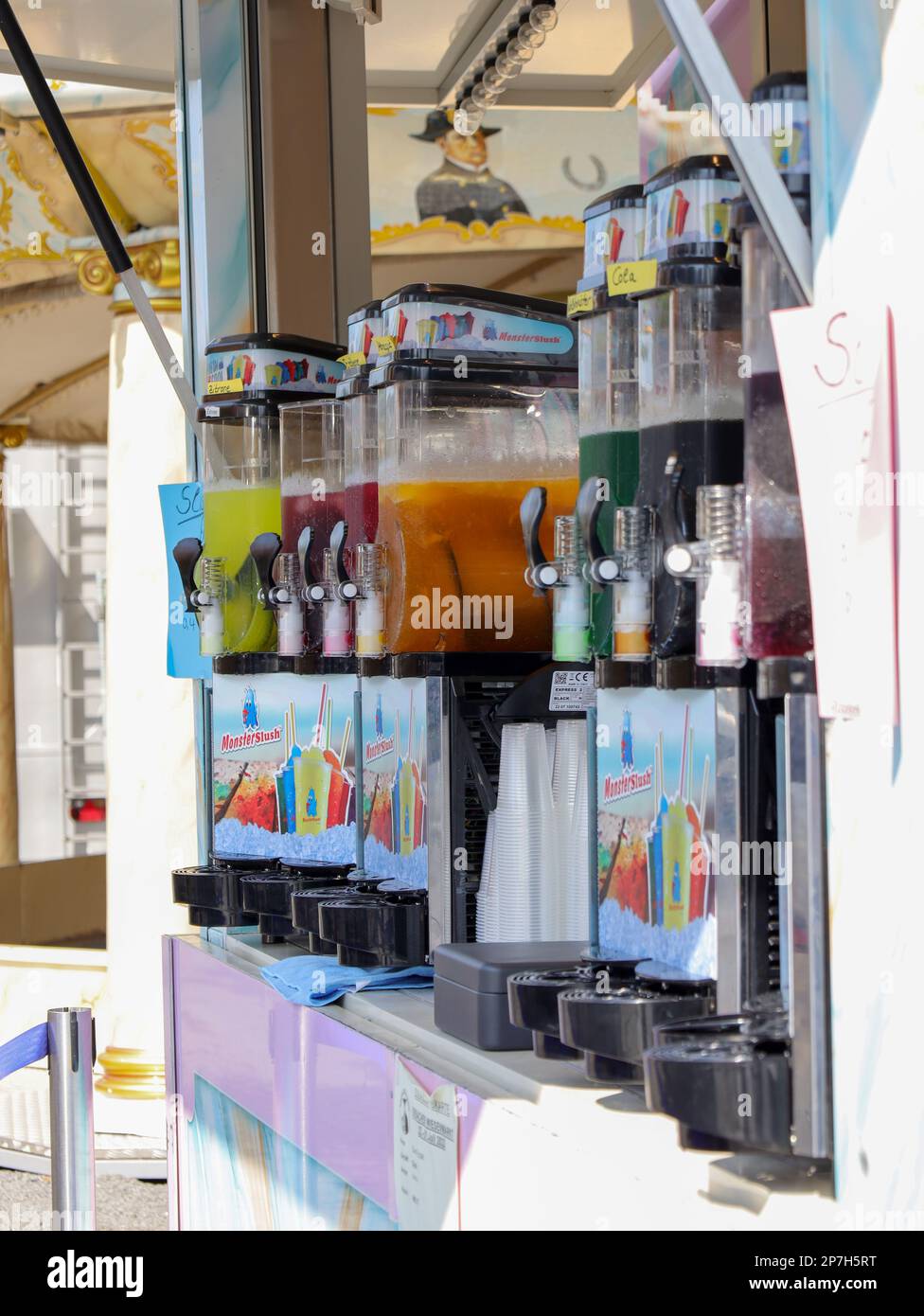colorful booths and fun rides at a fairground Stock Photo - Alamy