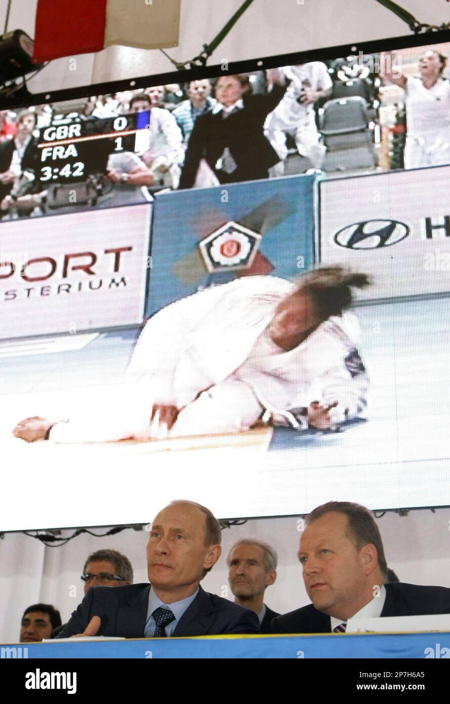 Visiting Russian Prime Minister Vladimir Putin, left, and Marius Vizer ...