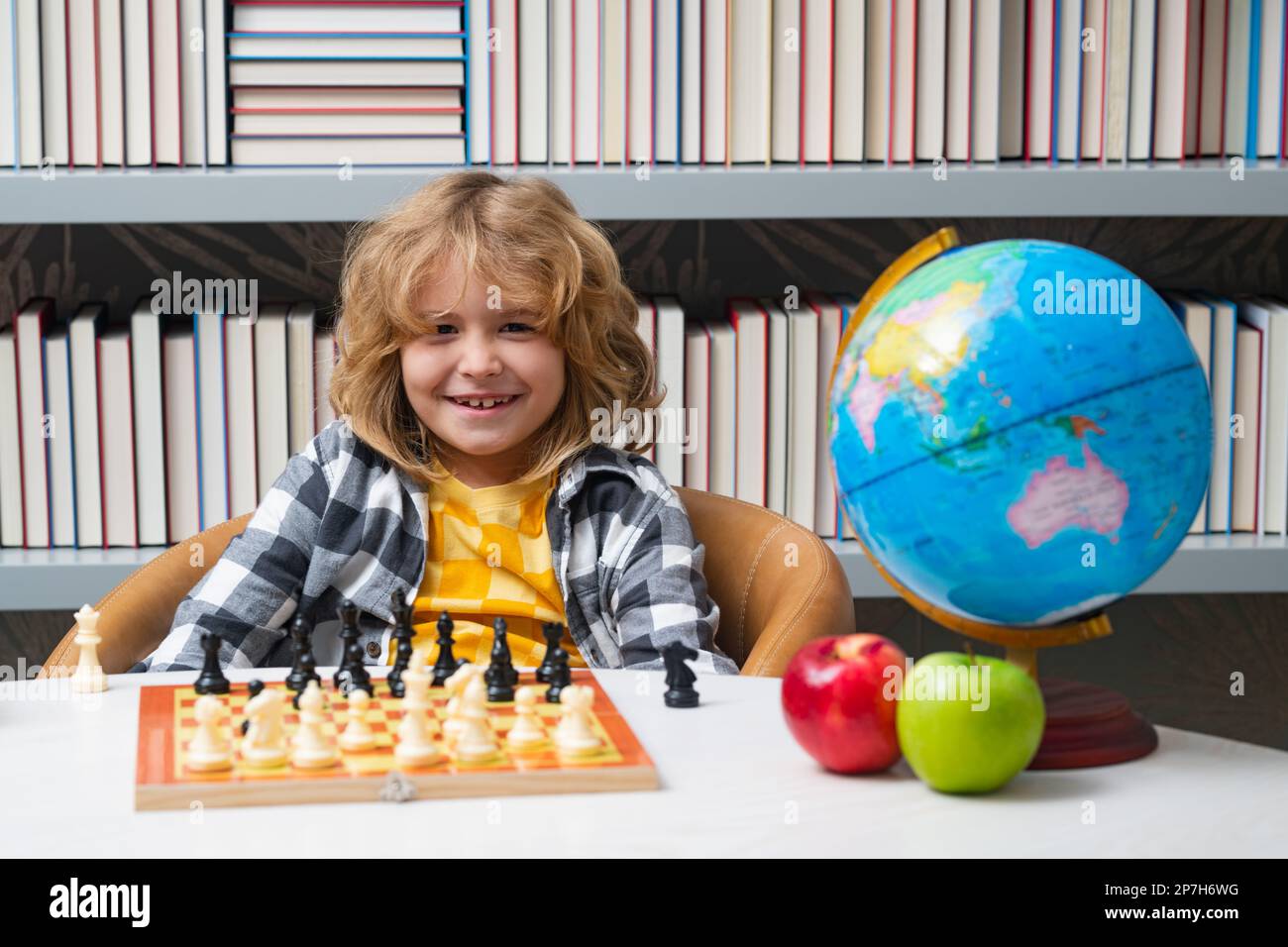 Chess school for children. Clever concentrated and thinking child ...