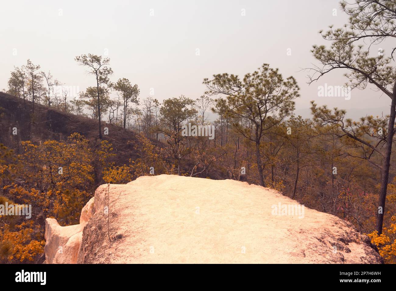 Walker in mountain trail, go along the narrow ridge where the right and ...