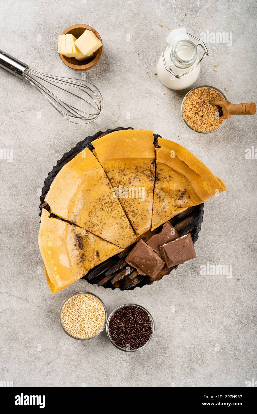 Martabak manis or terang bulan is indonesian sweet pancake filled with ...