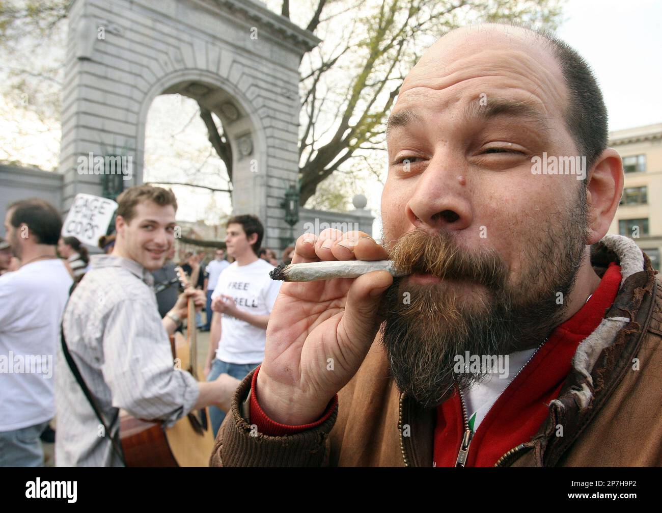 Rich Paul takes a puff of a marijuana joint in front of the Statehouse ...