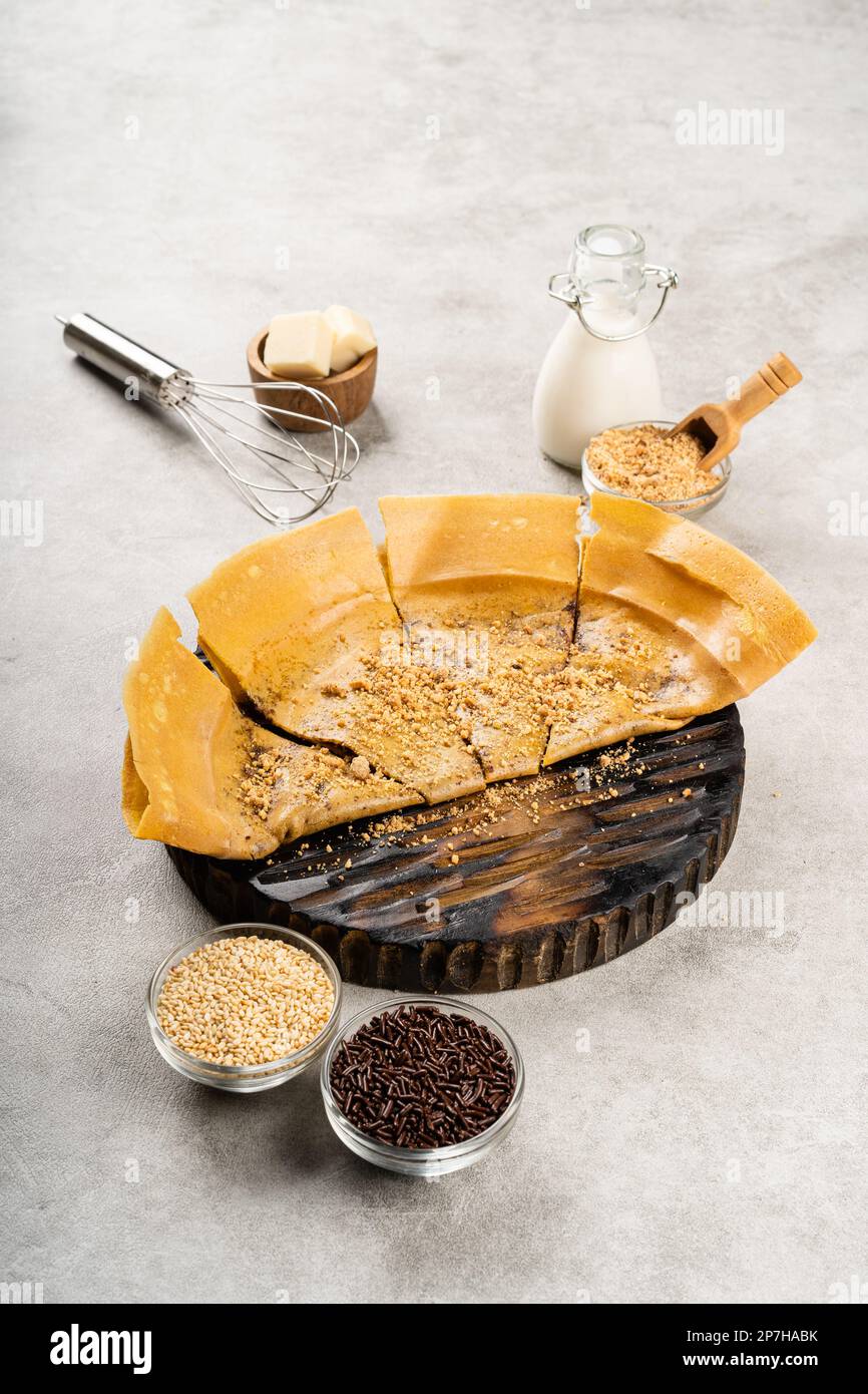 Martabak manis or terang bulan is indonesian sweet pancake filled with ...