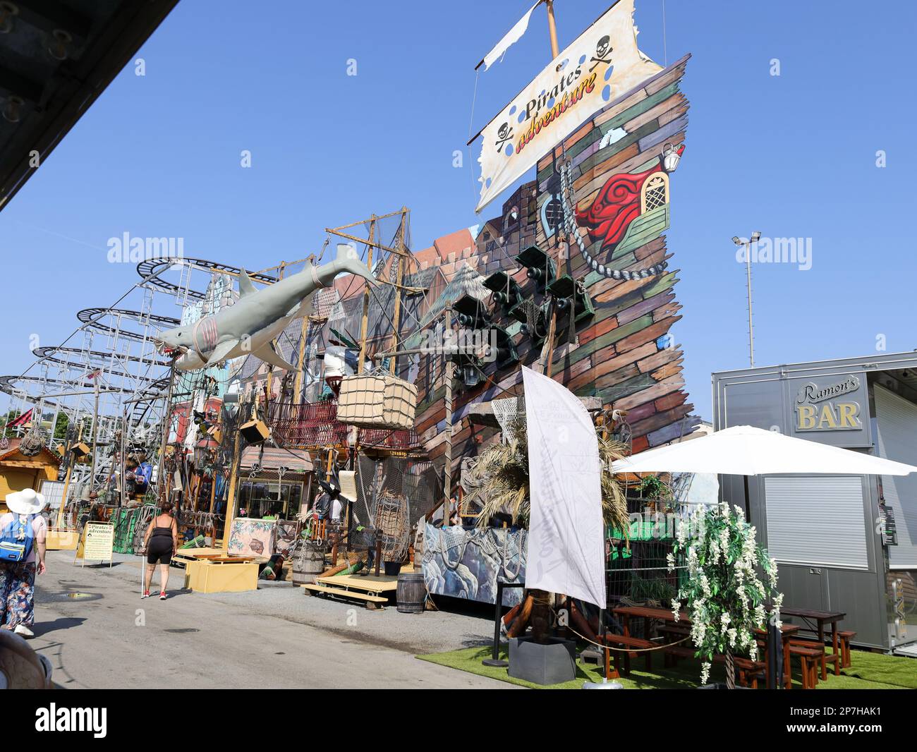 colorful booths and fun rides at a fairground Stock Photo - Alamy