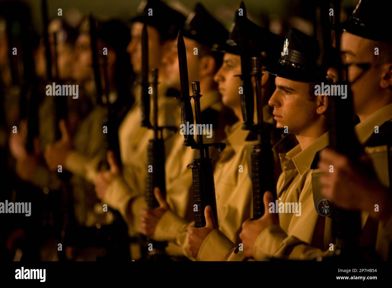 Soldiers from an Israeli military honor guard stand at attention during ...