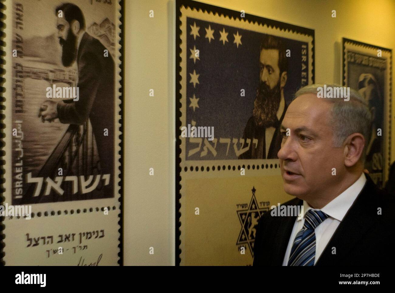 Israeli Prime Minister Benjamin Netanyahu looks at posters of stamps ...