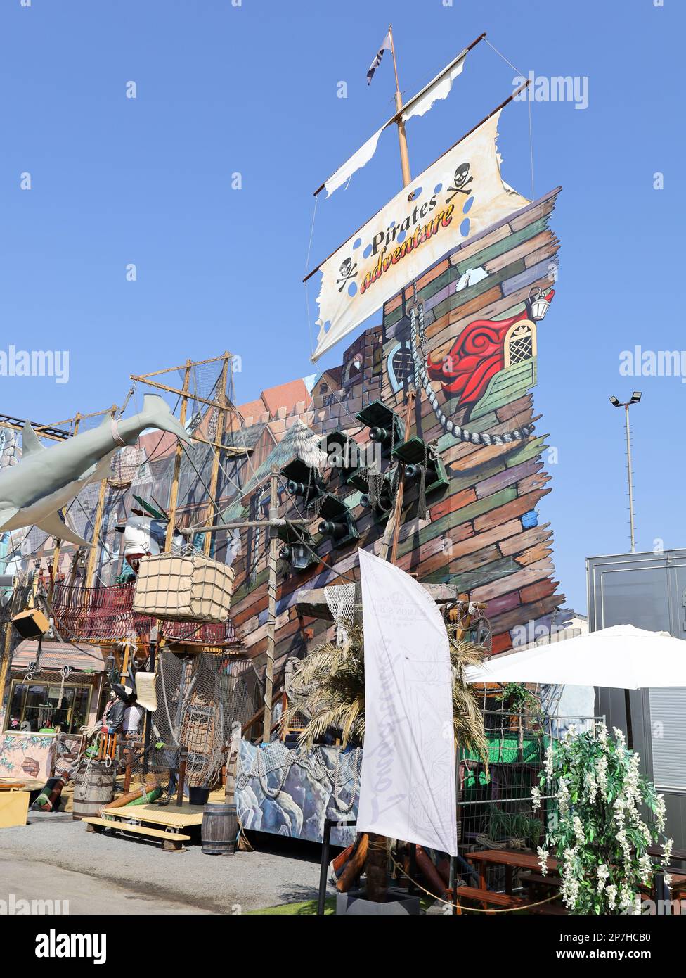 colorful booths and fun rides at a fairground Stock Photo - Alamy