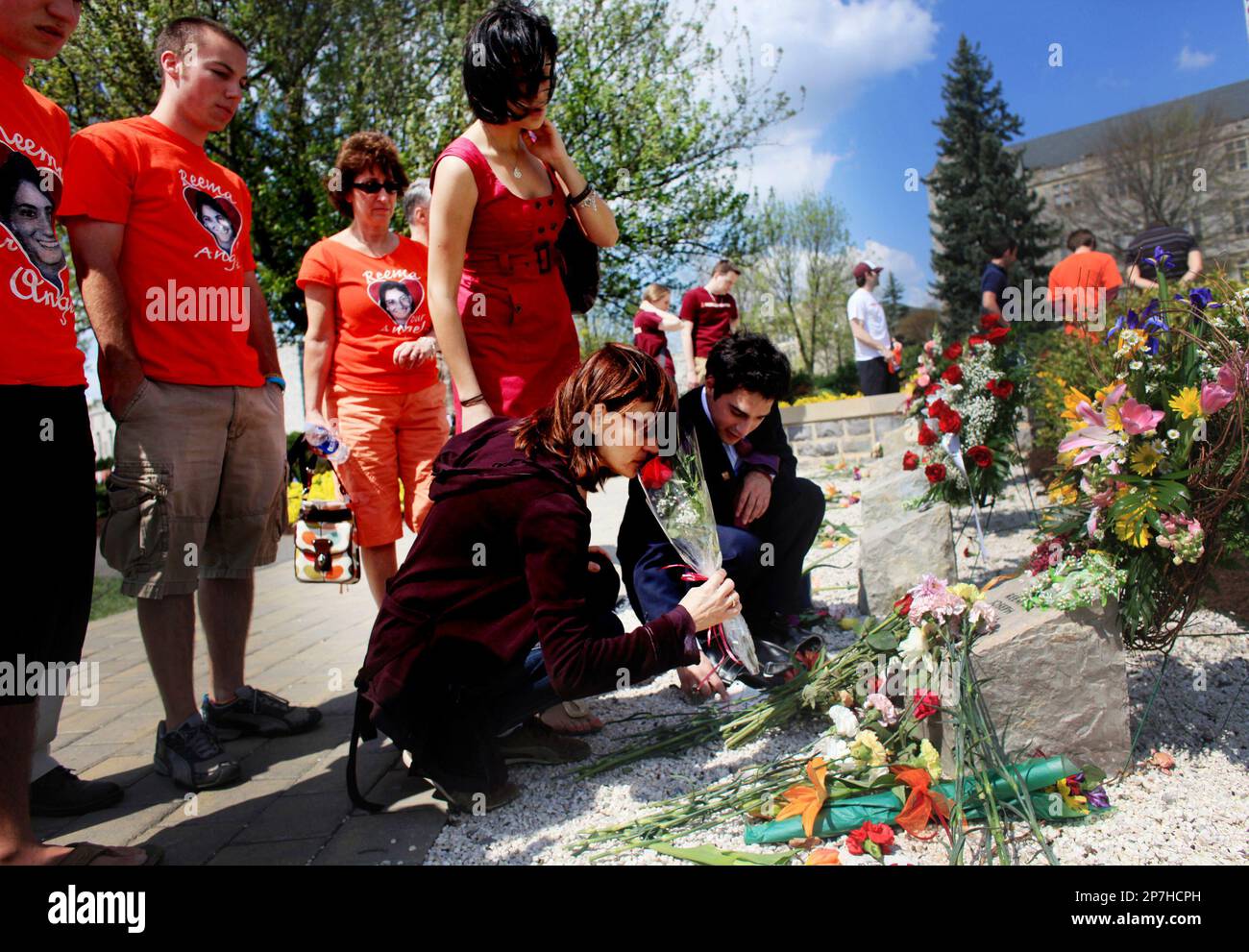 Mona Samaha smells a rose left at the memorial stone of her daughter ...