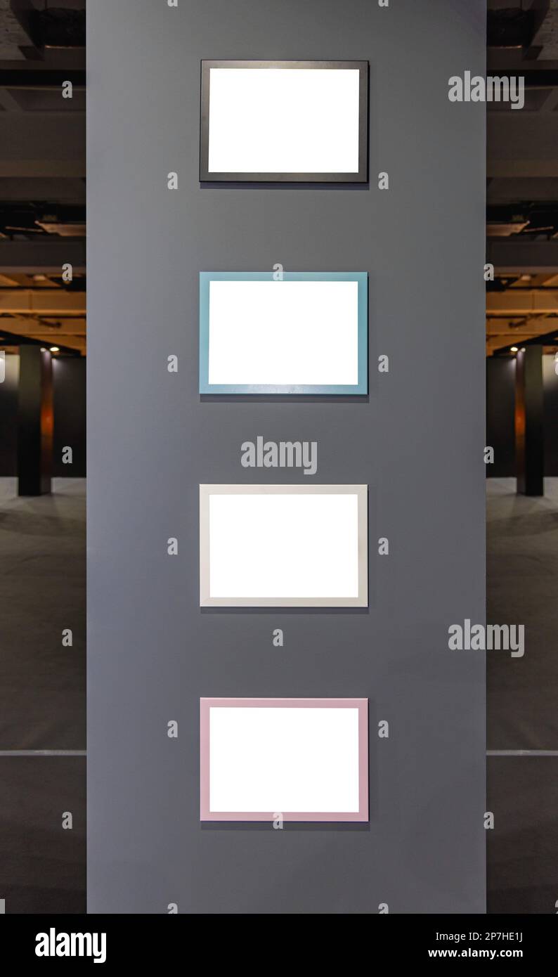 Four Picture Frames at Grey Wall Copy Space Stock Photo - Alamy