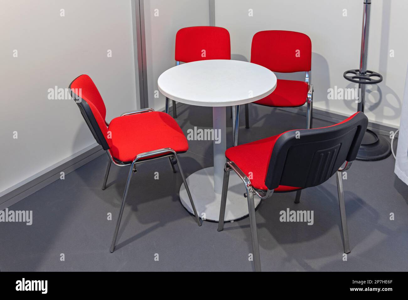 Round White Table With Four Red Chairs Office Booth Stock Photo - Alamy