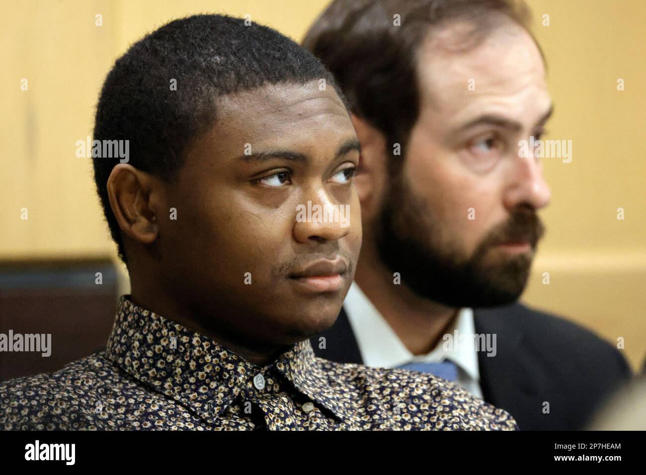 Suspected shooting accomplice Trayvon Newsome is shown seated at the ...